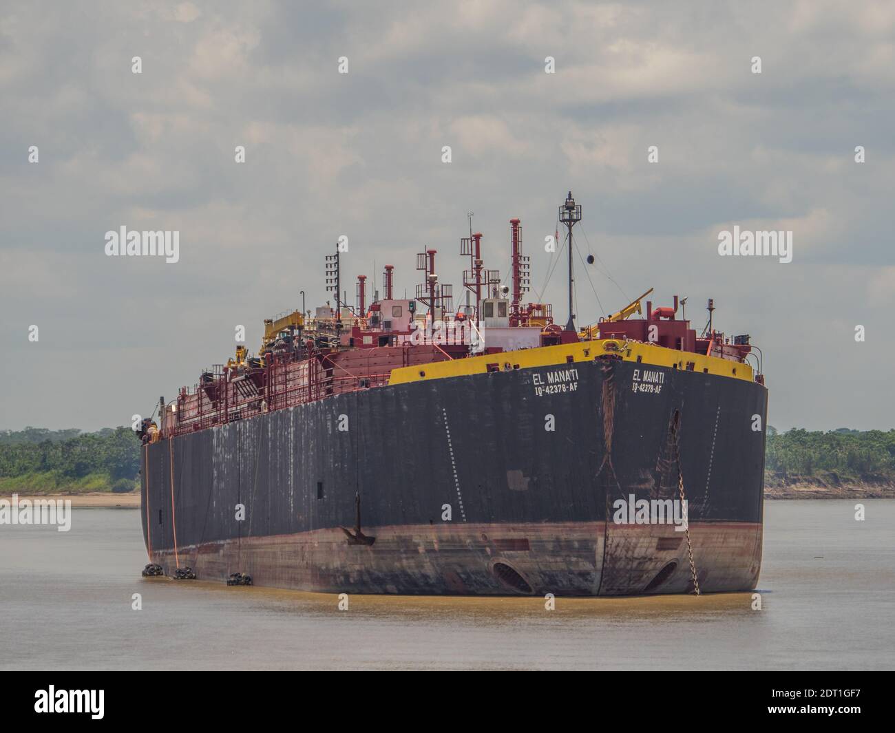 Oceanic ship and local boat on the Amazon River over 3,000 km from the ...