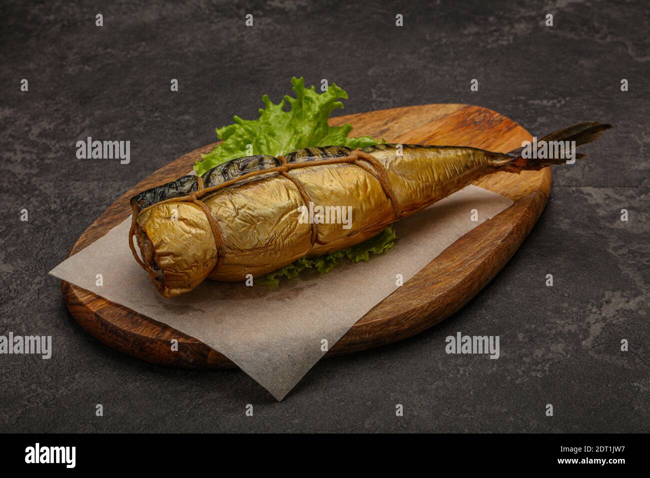 Smoked tasty mackerel fish snack over board Stock Photo - Alamy
