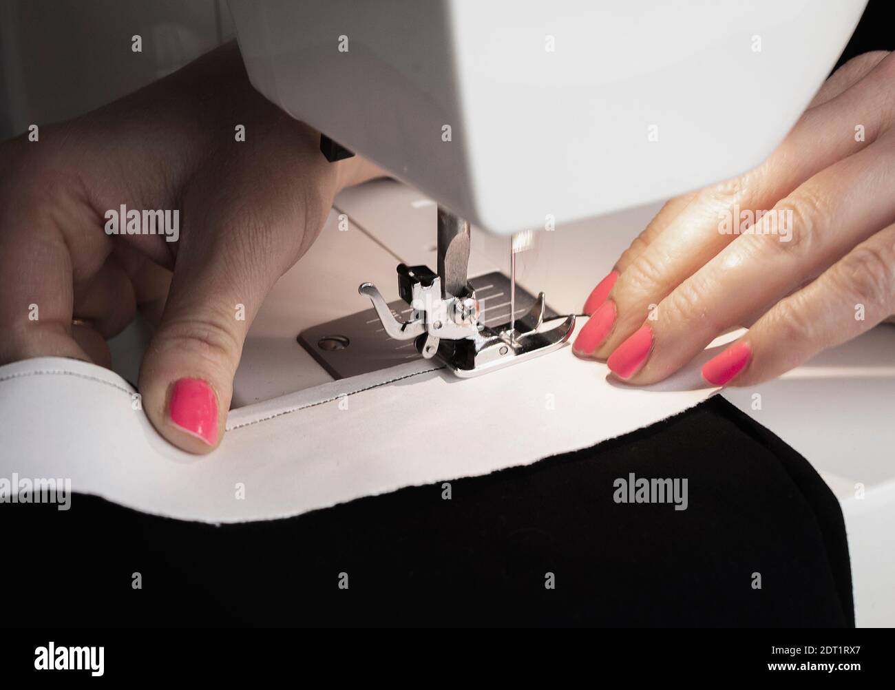 Hands seamstress sewing workflow Stock Photo - Alamy
