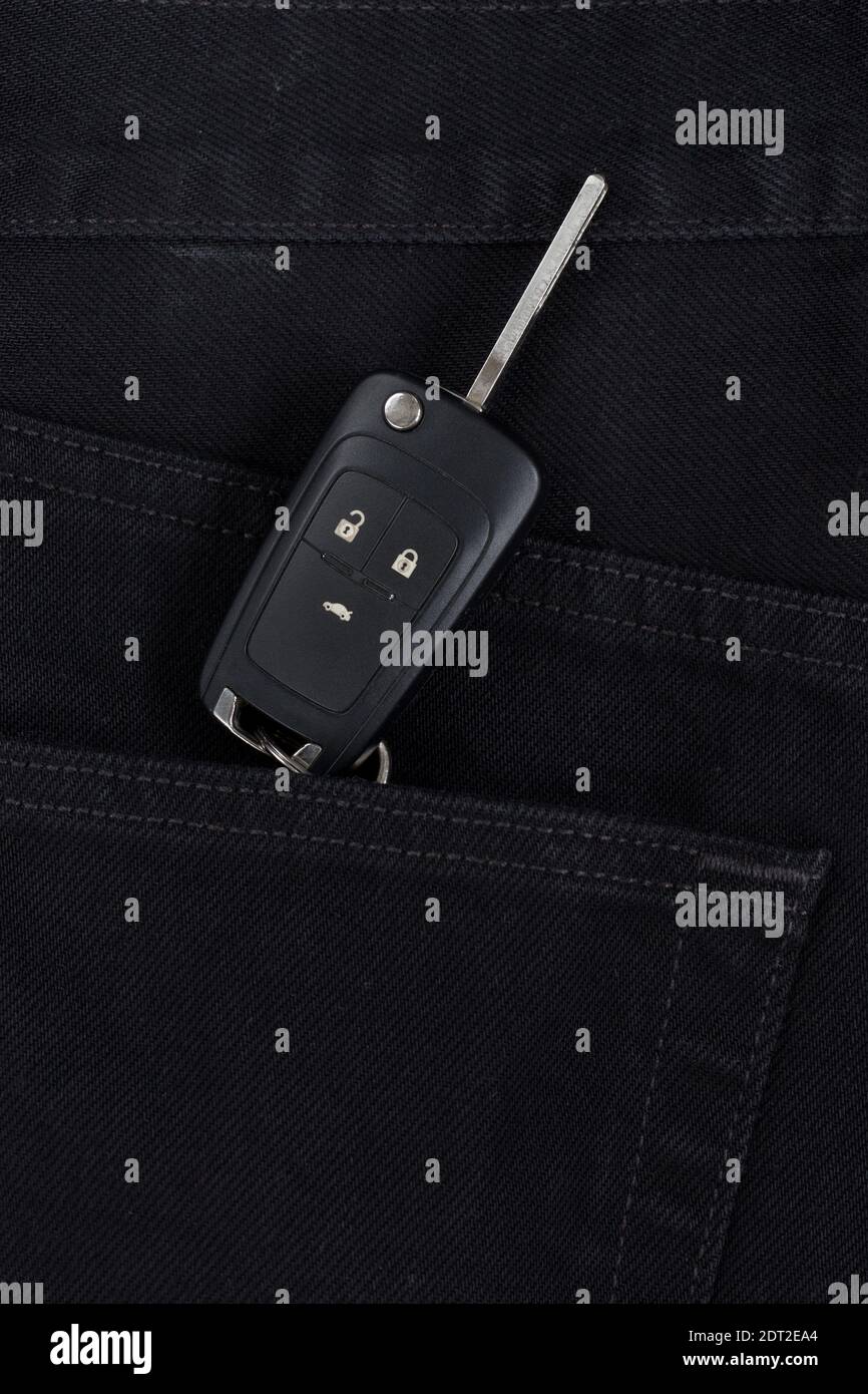 Switch key is lying in side pocket of black pants. Modern lifestyle ...