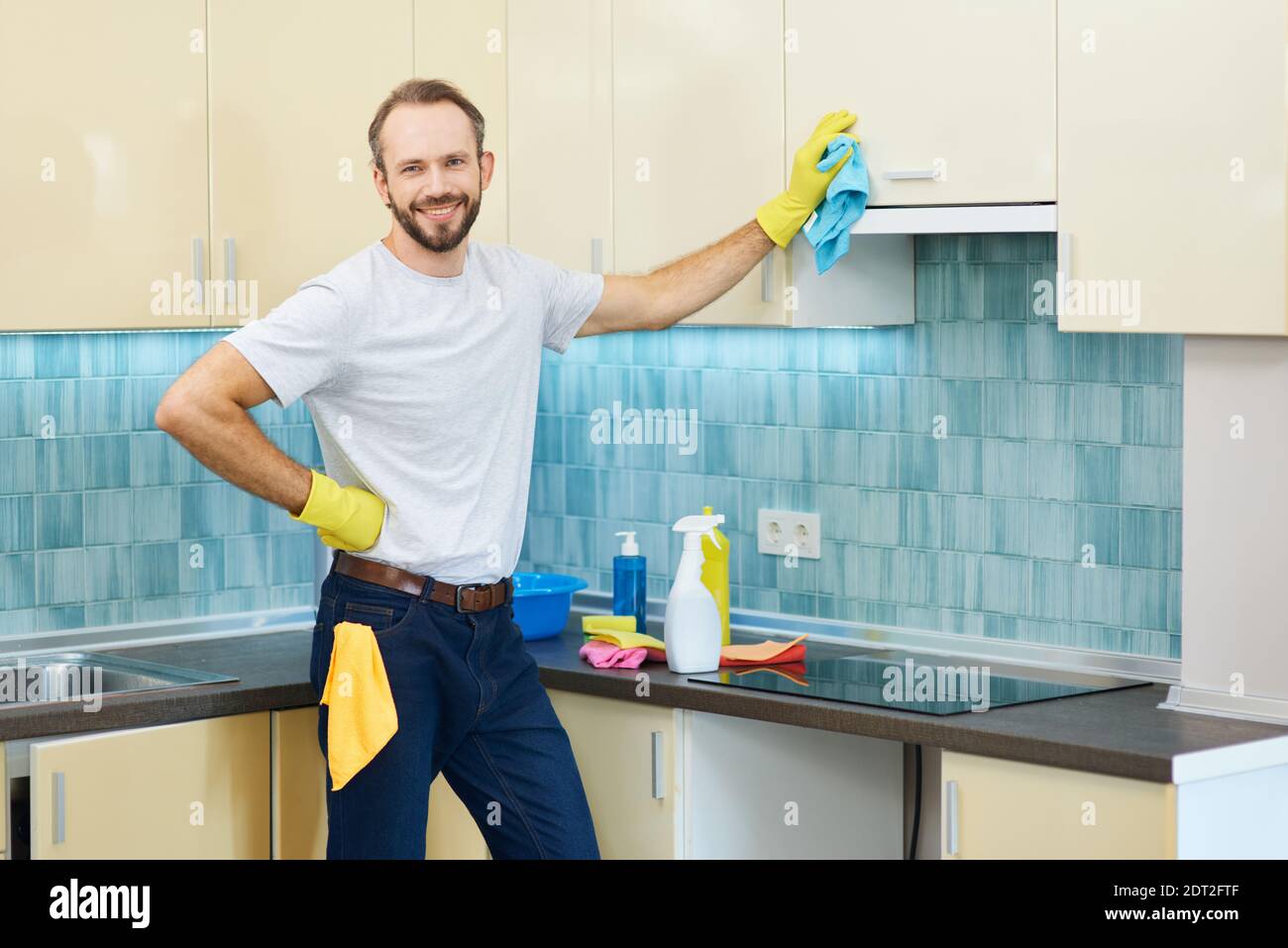 Housekeeping services. Cheerful professional male cleaner wearing ...