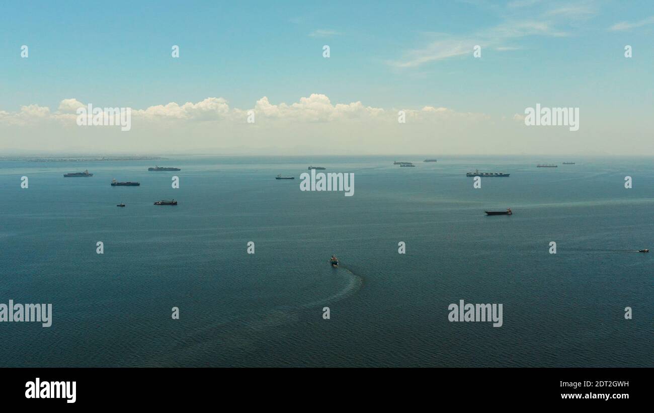 Cargo vessels in Manila Bay view from above. Cargo ships in the harbor ...
