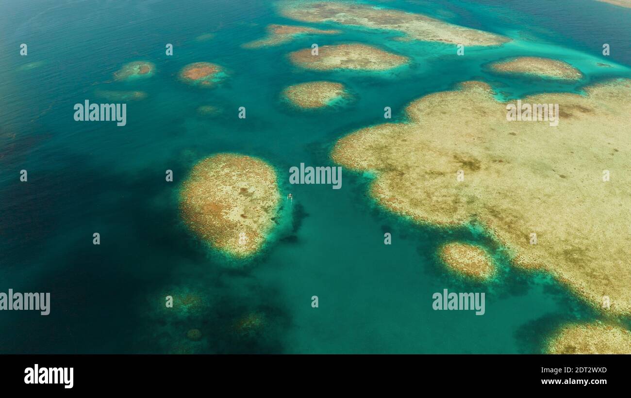 Sea water surface in lagoon with coral reef copy space for text, aerial ...
