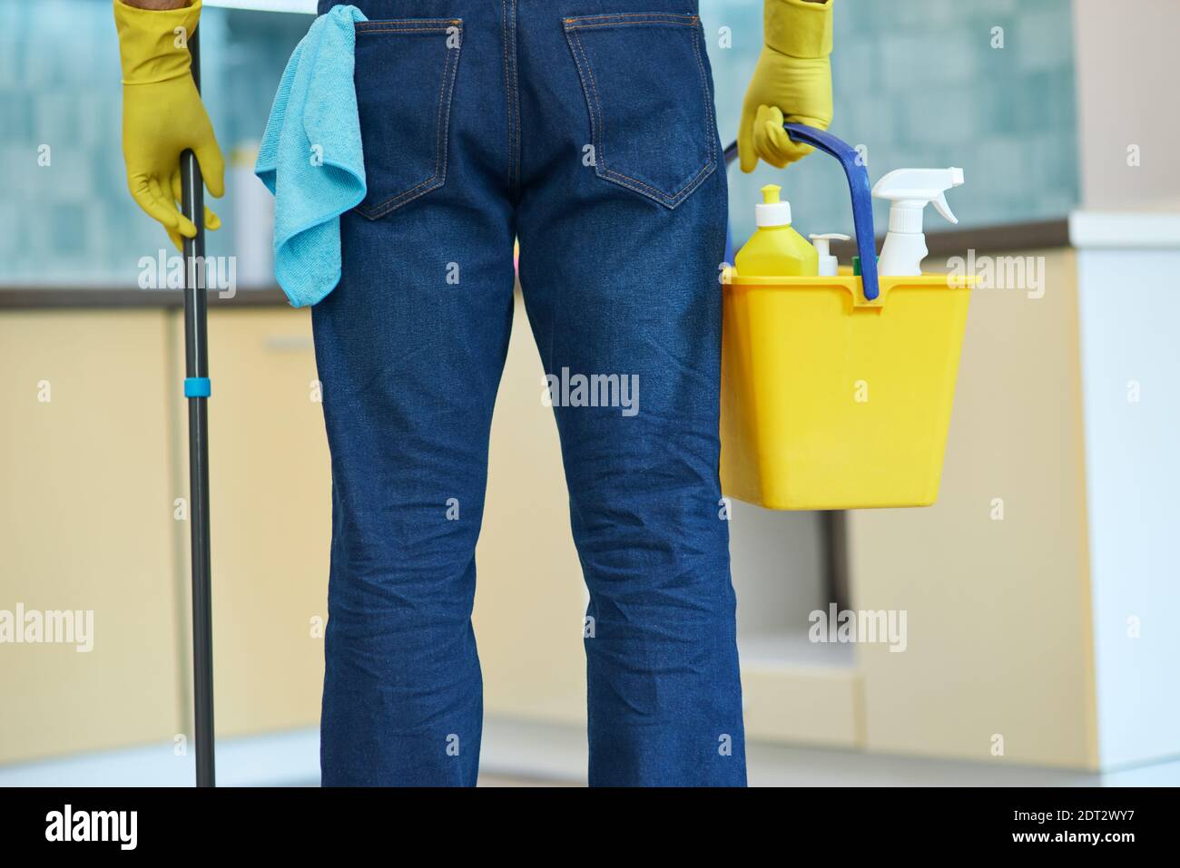 Professional house cleaning. Cropped shot of professional male cleaner ...