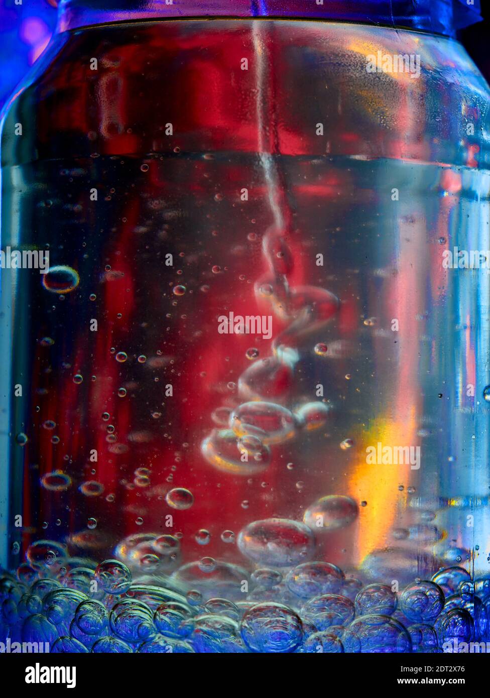 Brightly coloured abstract with bubbles caused by a chemical reaction ...