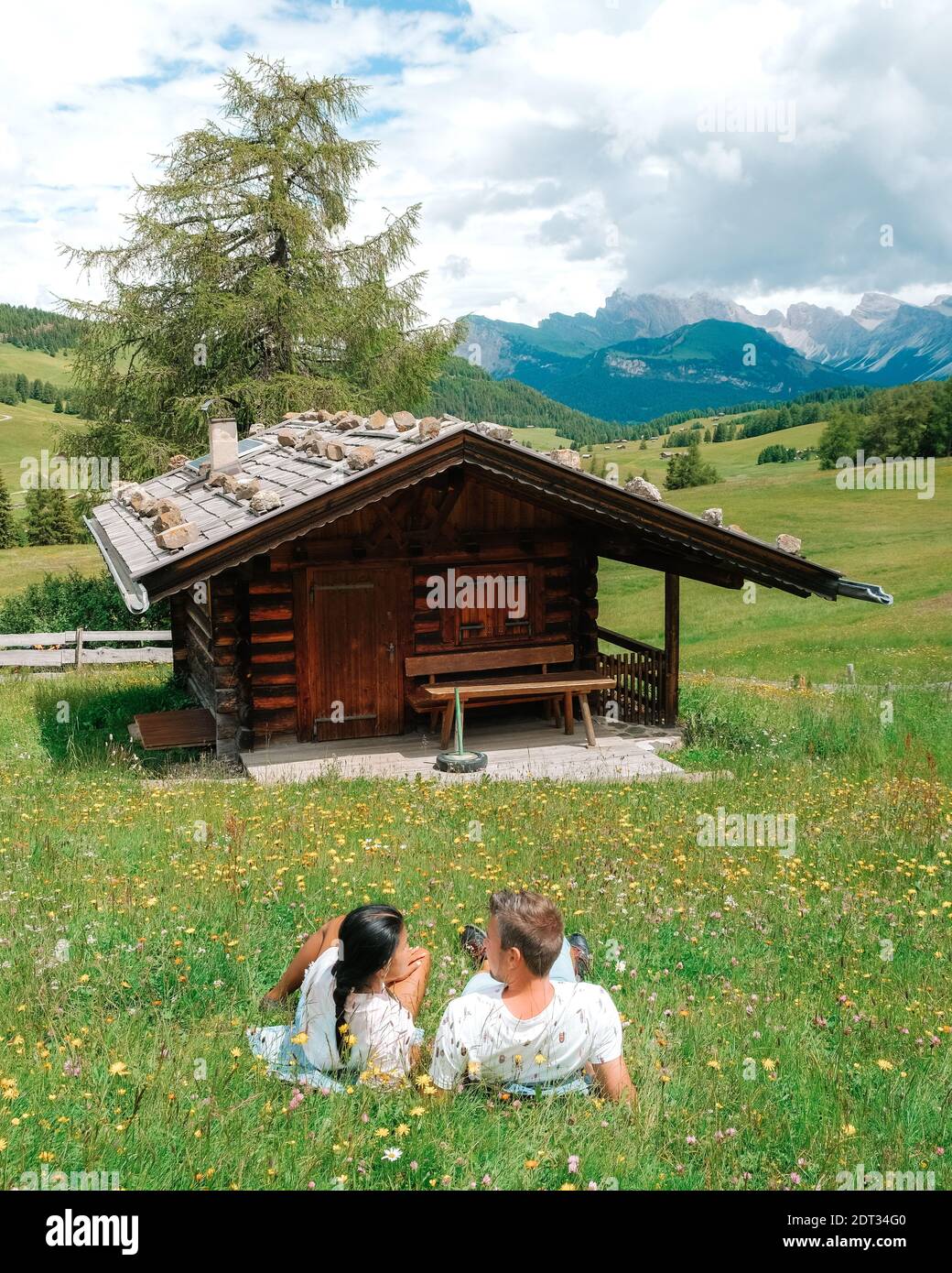 couple mid-age men and woman visiting the Italian Dolomites in Italy ...