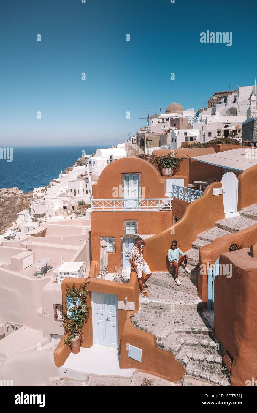 Santorini Island Greece, couple men and woman on vacation at the Greek ...