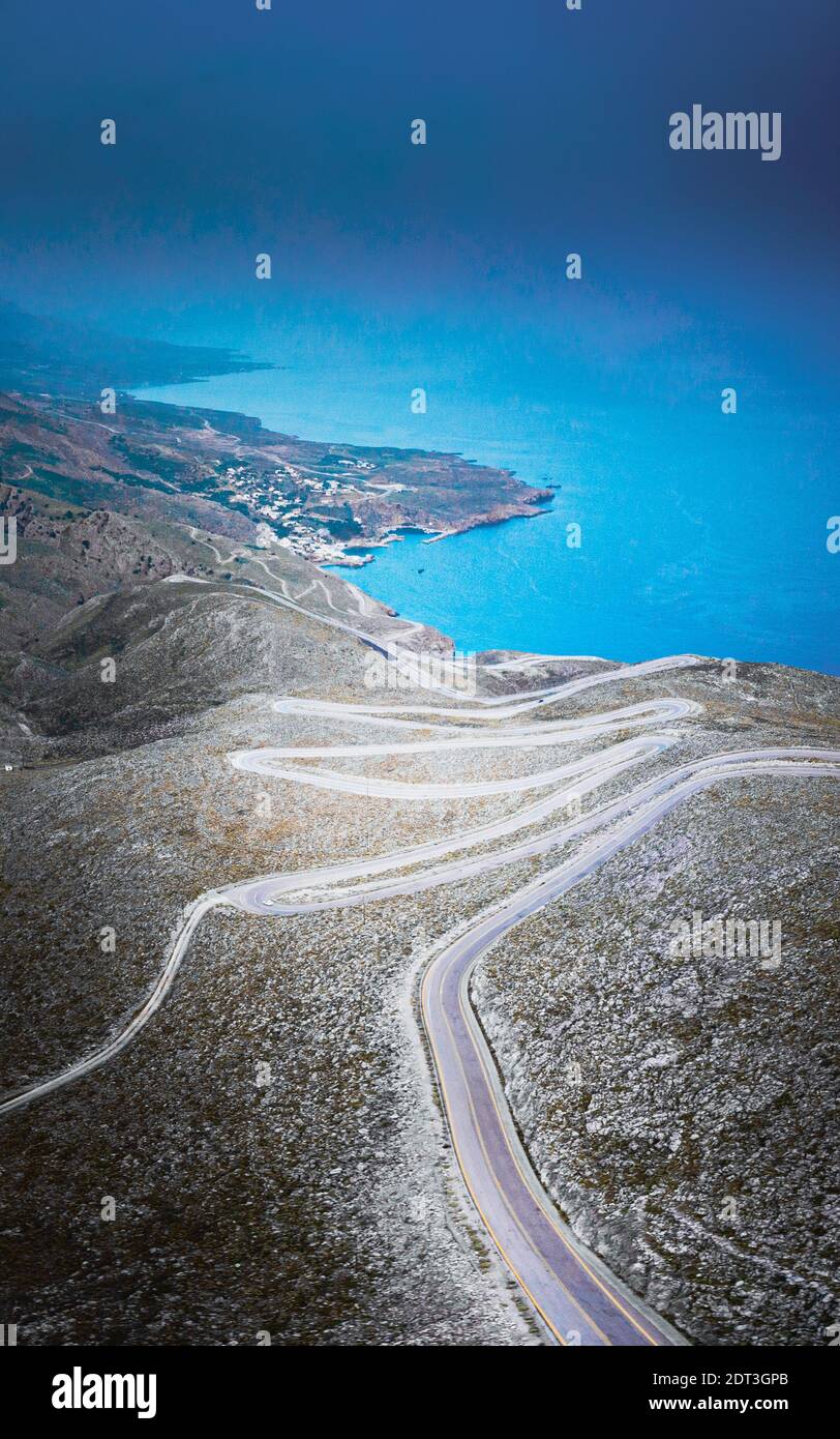 Elevated view of a winding road on rocky mountain landscape at crete ...