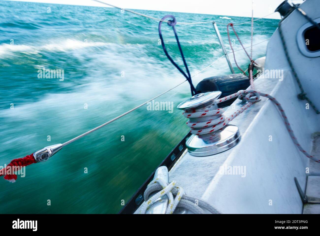 Close up of a sailing yacht with splashing water in sea Stock Photo - Alamy