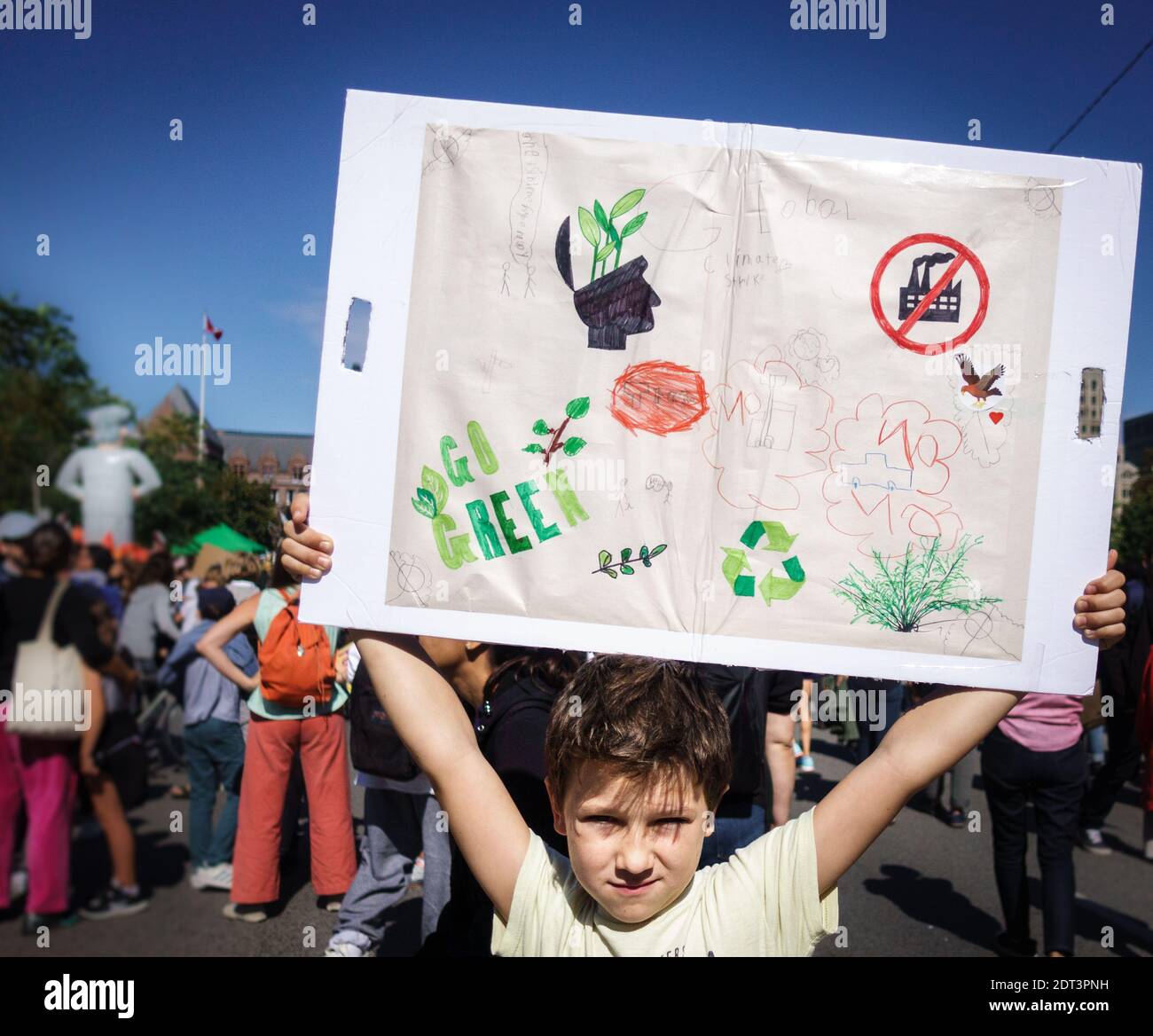 Portrait of a little boy holding poster on global strike for climate ...