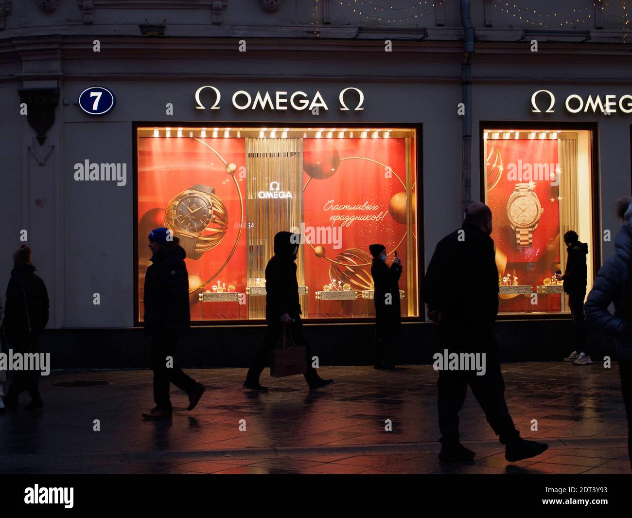 People walk past windows of the Omega brand store.The city of Moscow is ...