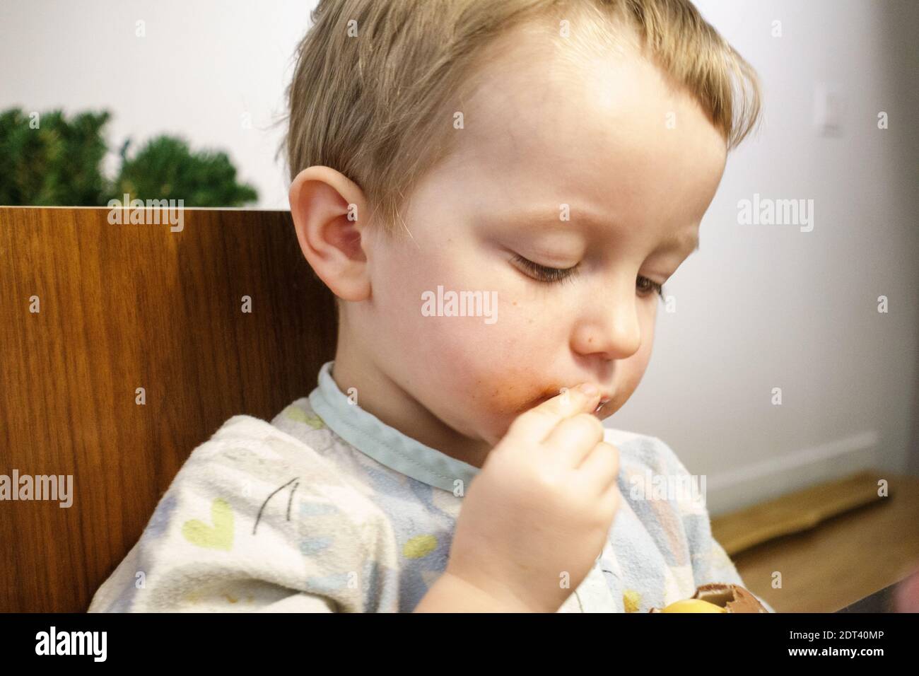 Cute little boy eating food Stock Photo - Alamy