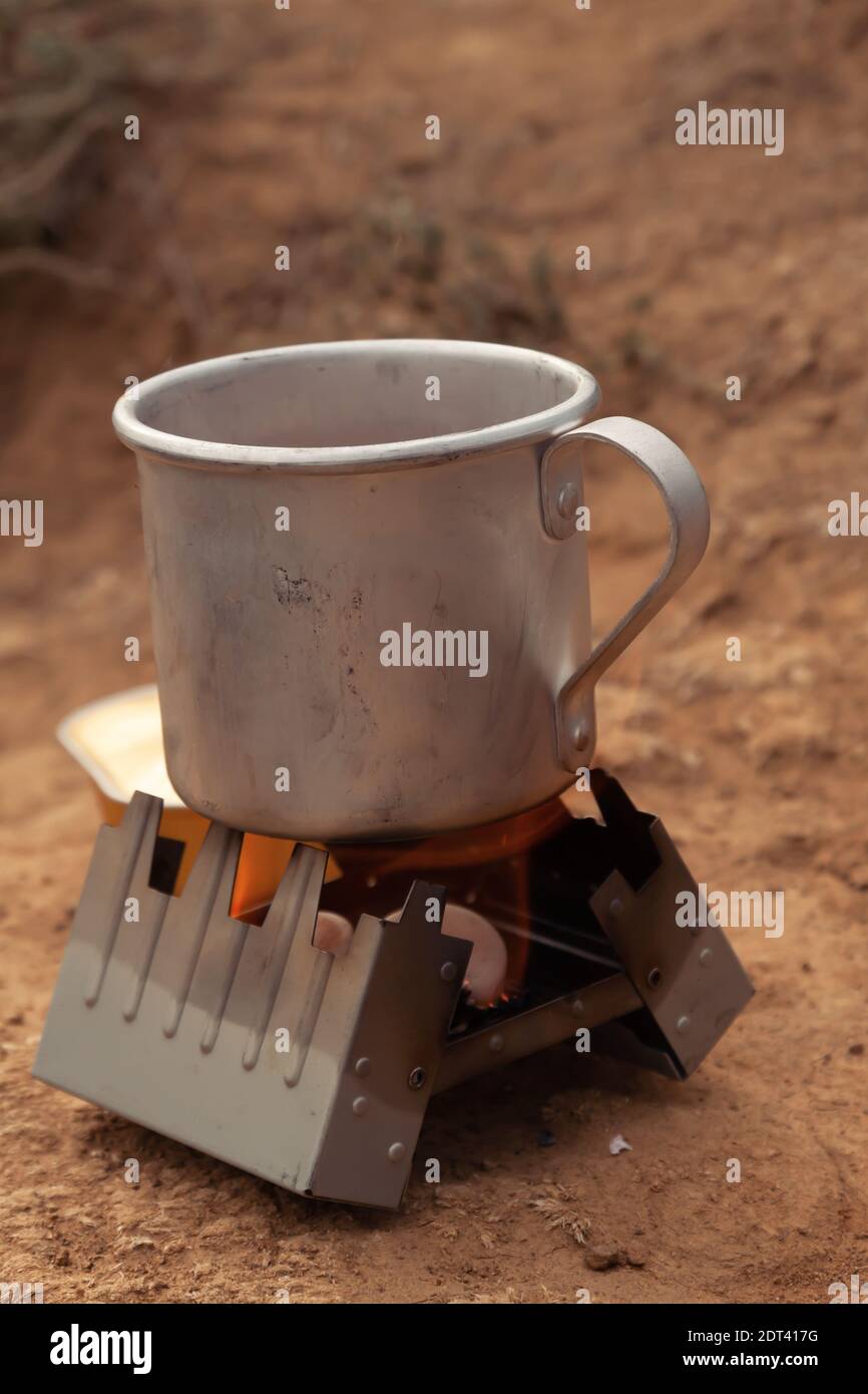 Iron, tourist mugs on an open fire during a camping trip Stock Photo ...