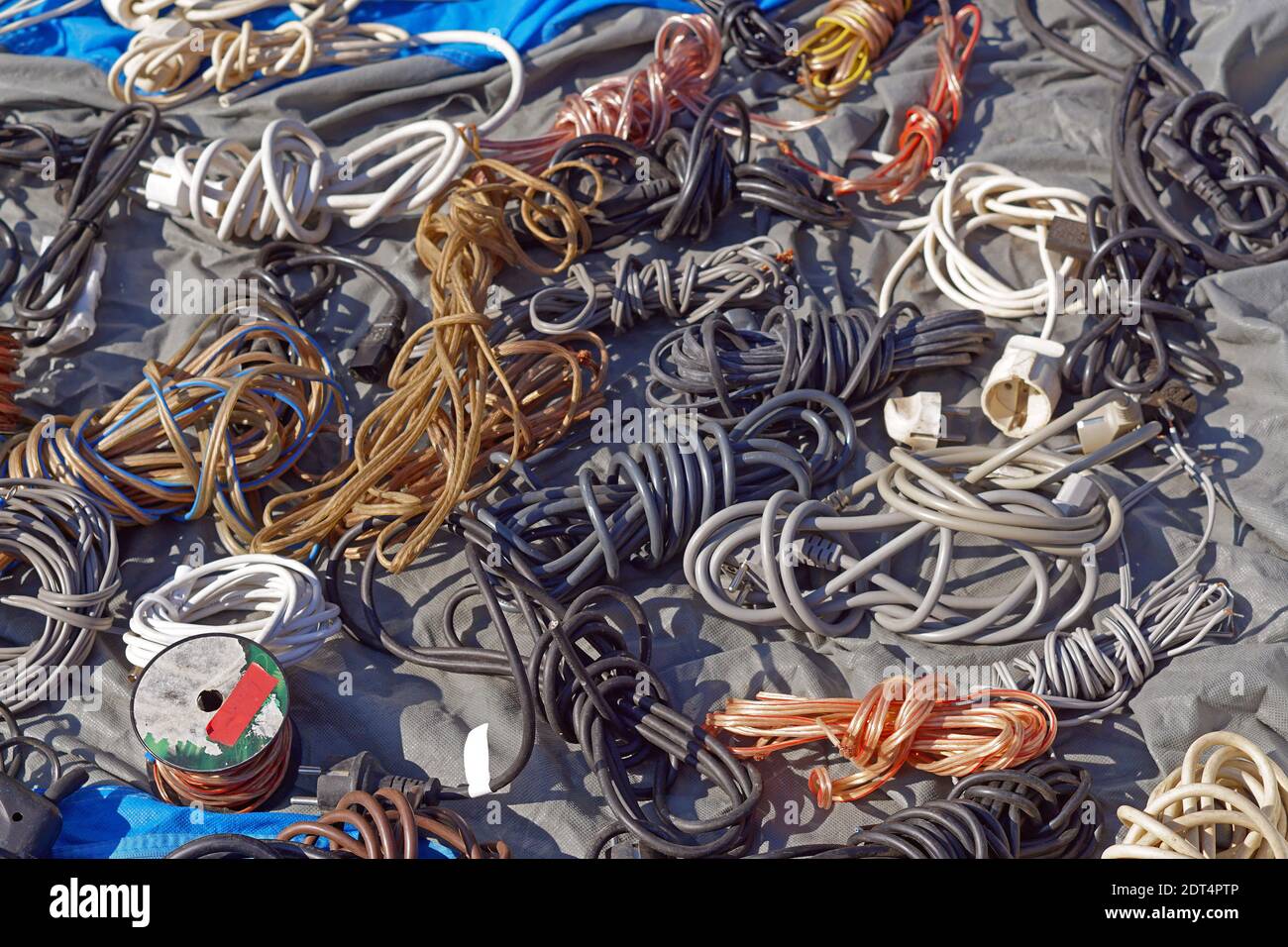 Used electric cord wires and cables at flea market Stock Photo - Alamy