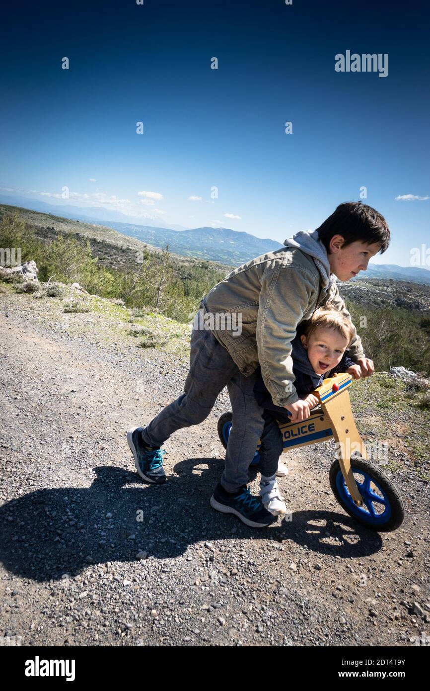 Two boys riding bicycle hi-res stock photography and images - Alamy