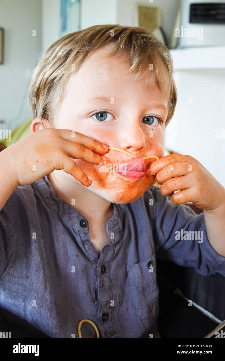 Boy eating spaghetti fun hi-res stock photography and images - Alamy