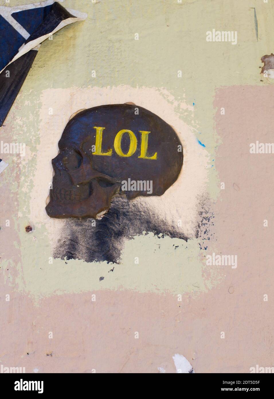 Skull sculpture with LOL, laugh out loud added Stock Photo - Alamy