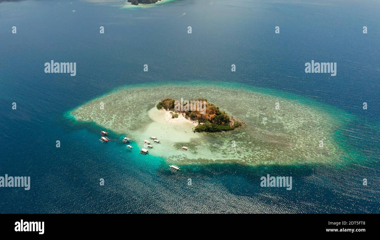 aerial view tropical island with sand white beach, clear and blue water ...