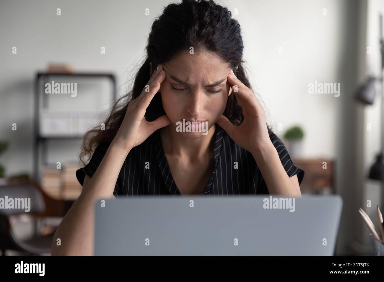 Unhealthy woman suffer from migraine working on computer Stock Photo ...