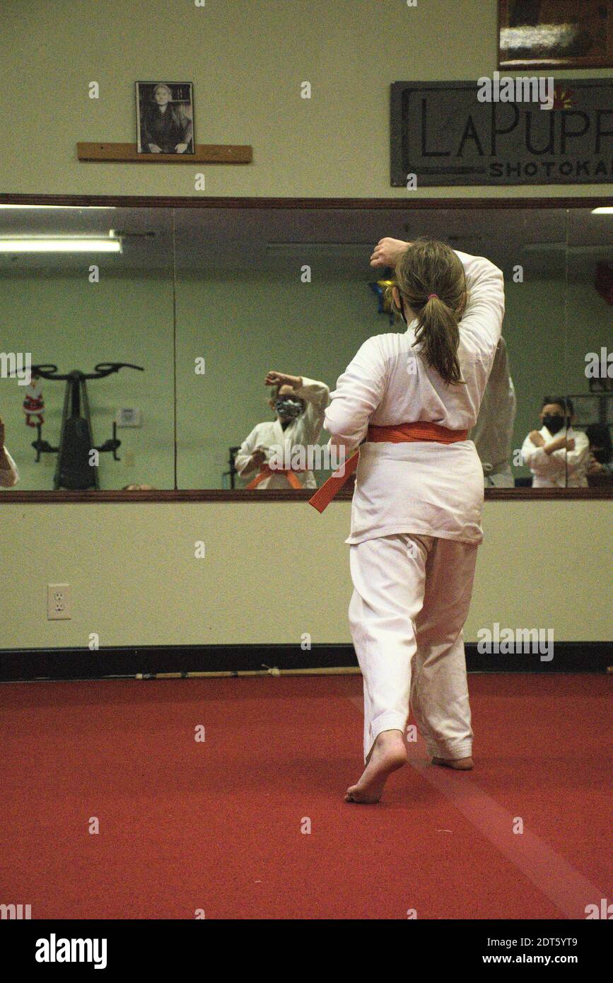 This action photo is of my daughter in her Karate class. Karate is a ...