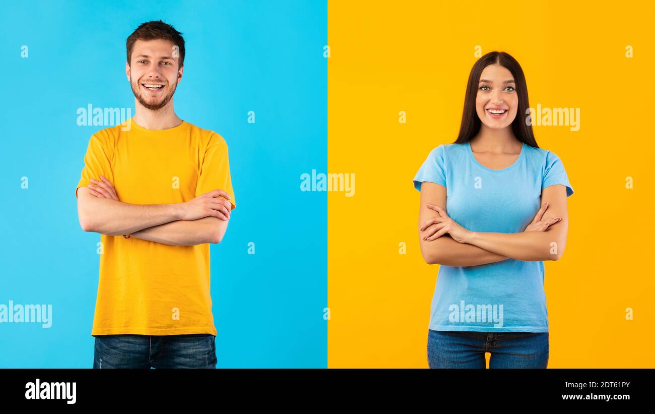 Smiling confident couple posing with folded arms on studio background ...