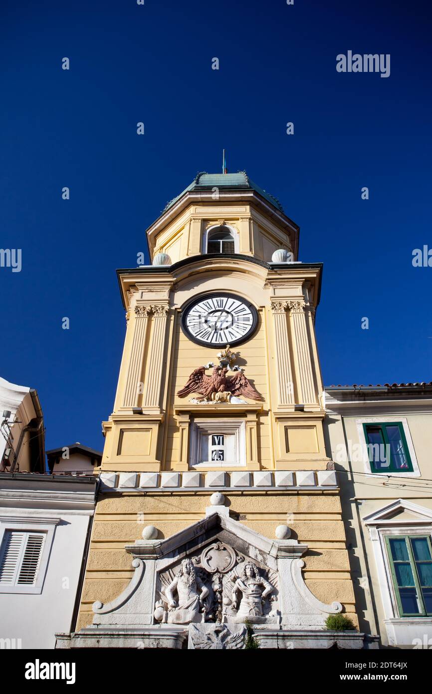 Yellow Clock Tower with Relief in Rijeka, Croatia Stock Photo - Alamy