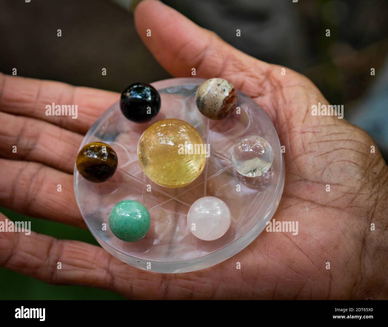 Hand holding marbles hi-res stock photography and images - Alamy
