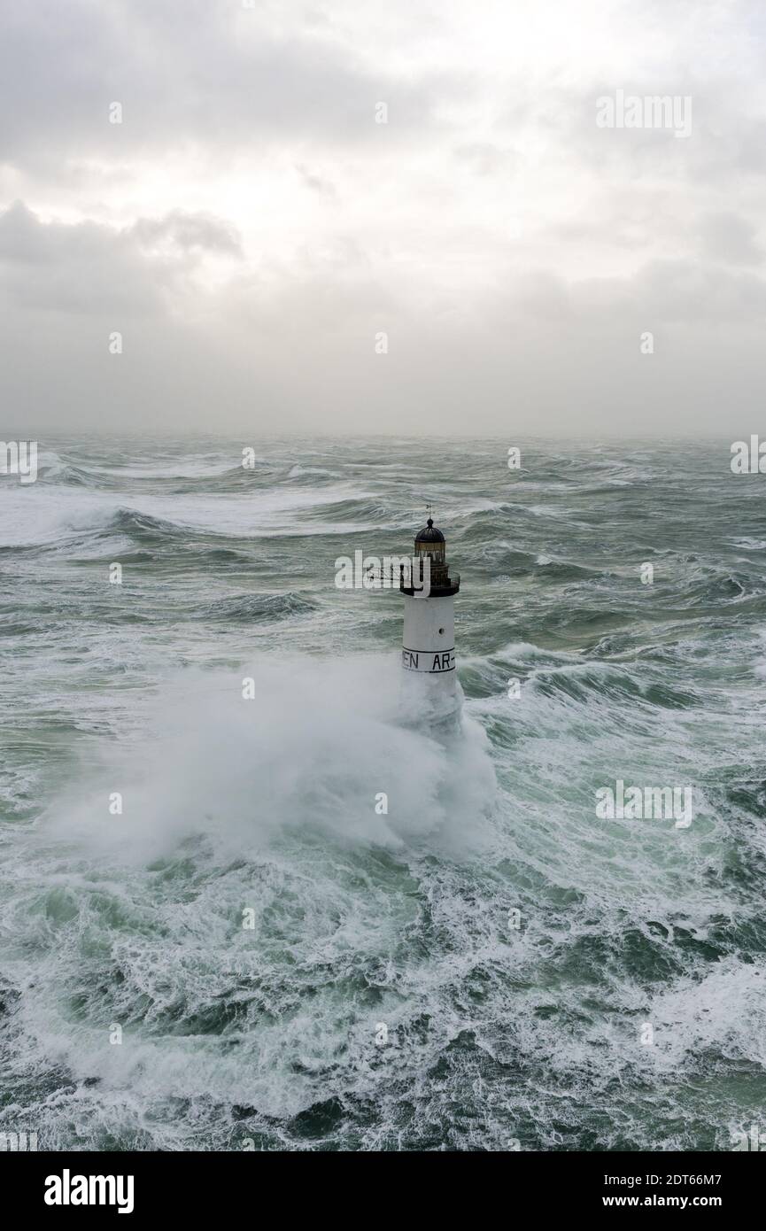 The 'Ar-Men' lighthouse during heavy storm off Brittany, western France ...