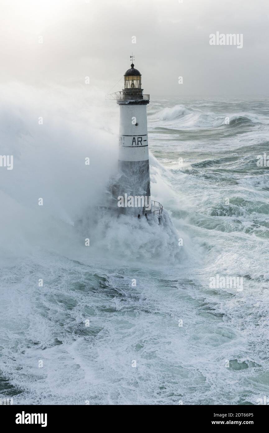 The 'Ar-Men' lighthouse during heavy storm off Brittany, western France ...