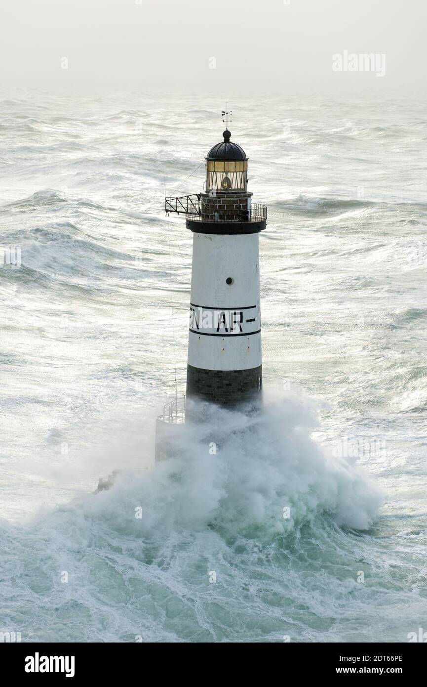 The 'Ar-Men' lighthouse during heavy storm off Brittany, western France ...