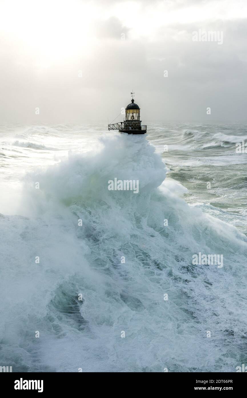 The 'Ar-Men' lighthouse during heavy storm off Brittany, western France ...