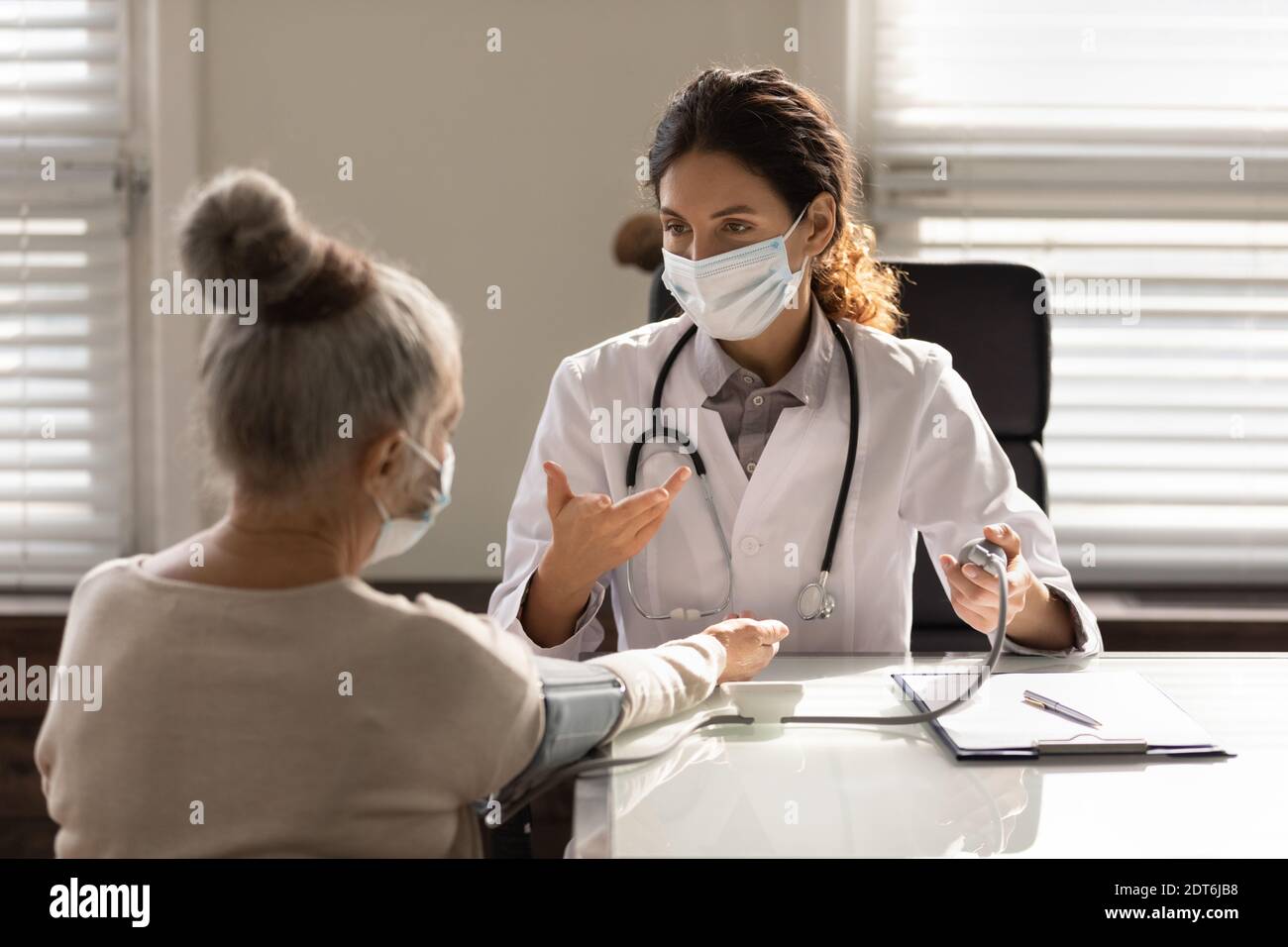 Female doctor examine elderly woman patient in clinic Stock Photo - Alamy