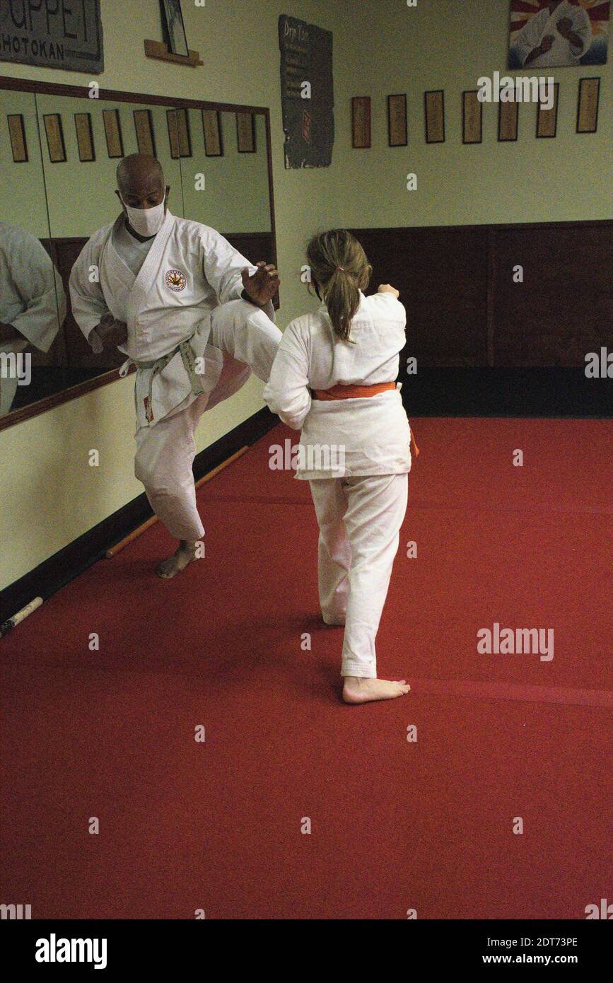This action photo is of my daughter in her Karate class. Karate is a ...
