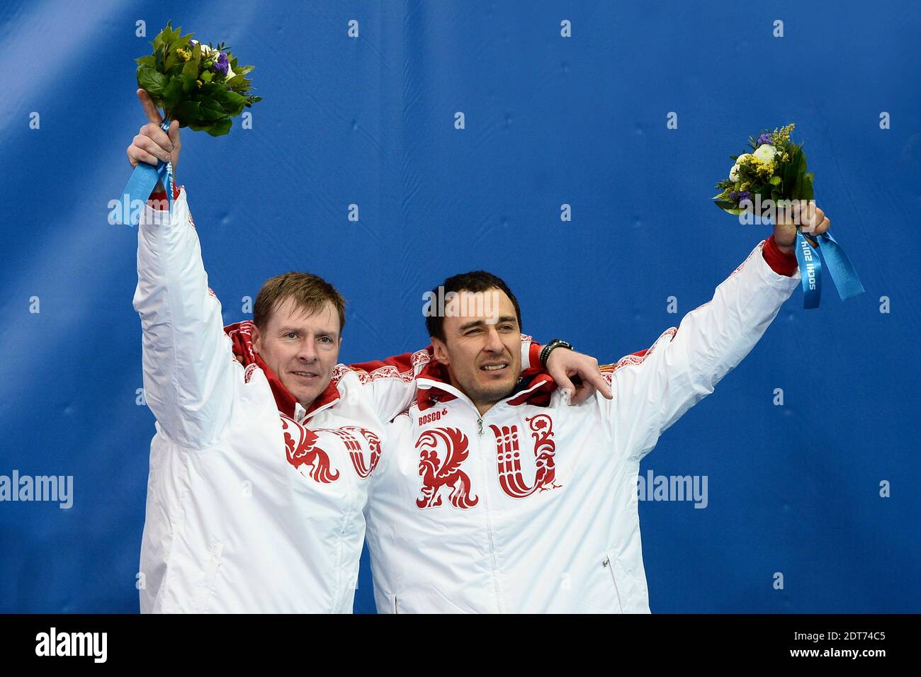 Gold medalists Alexander Zubkov and Alexey Voevoda of Russia team 1 ...