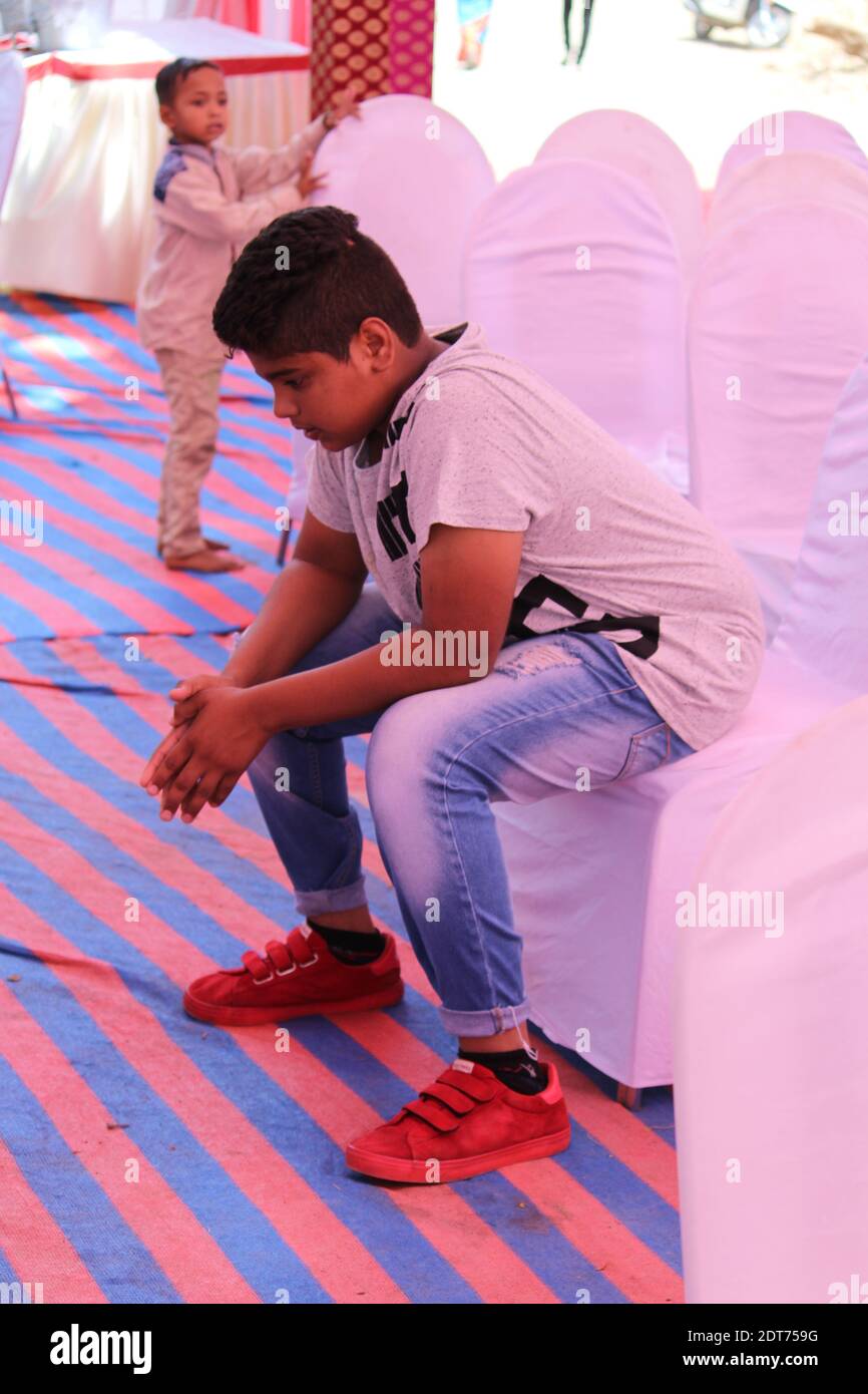 Two boys sitting sad hi-res stock photography and images - Alamy