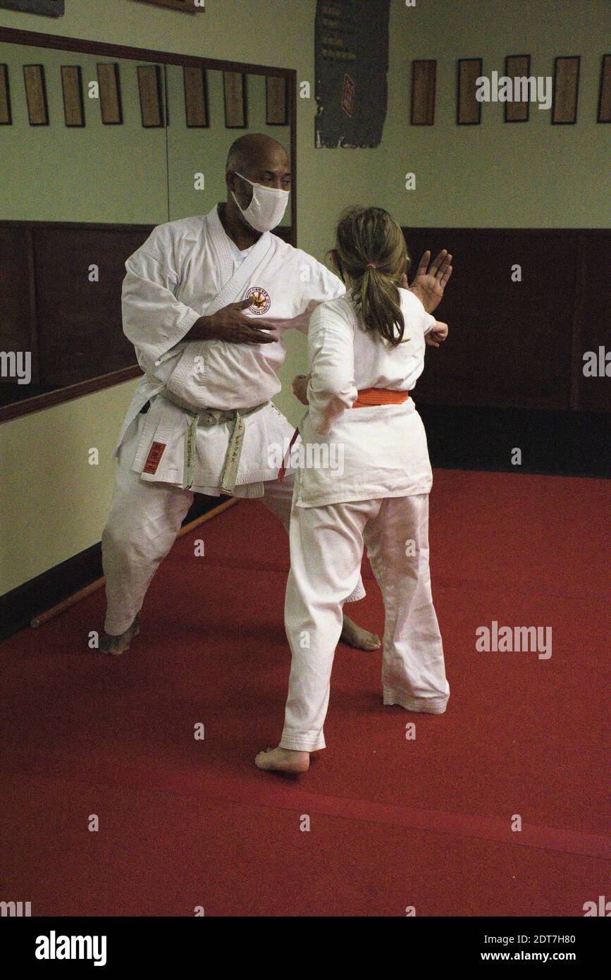 This action photo is of my daughter in her Karate class. Karate is a ...