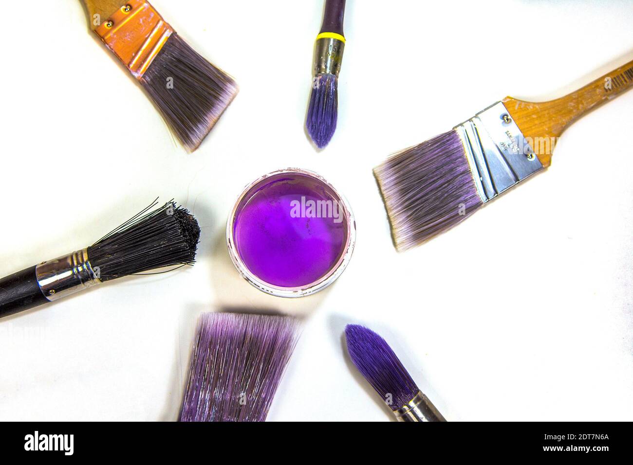 Painting brushes and a jar of purple paint, photo on a white background ...