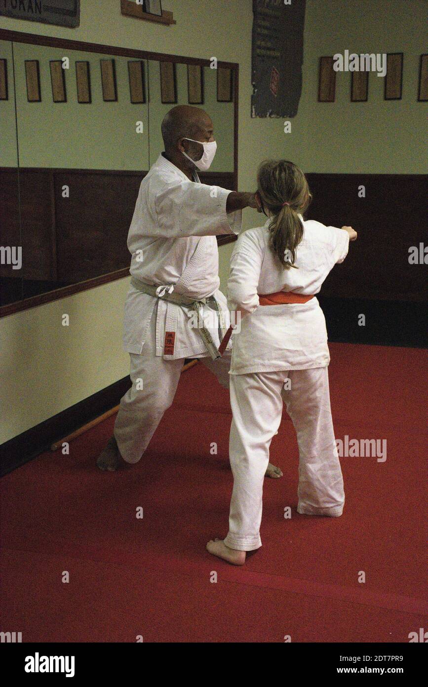 This action photo is of my daughter in her Karate class. Karate is a ...