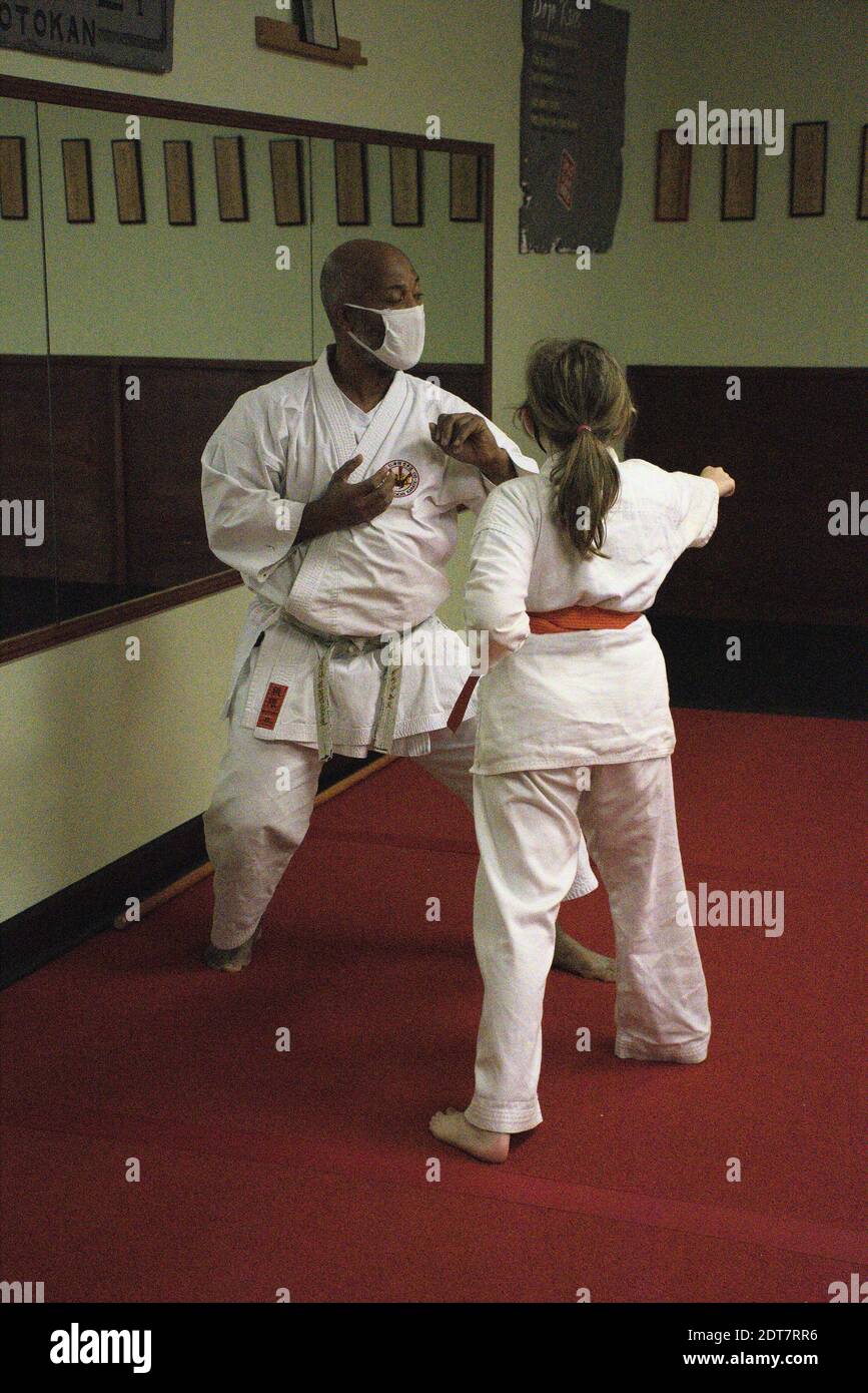 This action photo is of my daughter in her Karate class. Karate is a ...