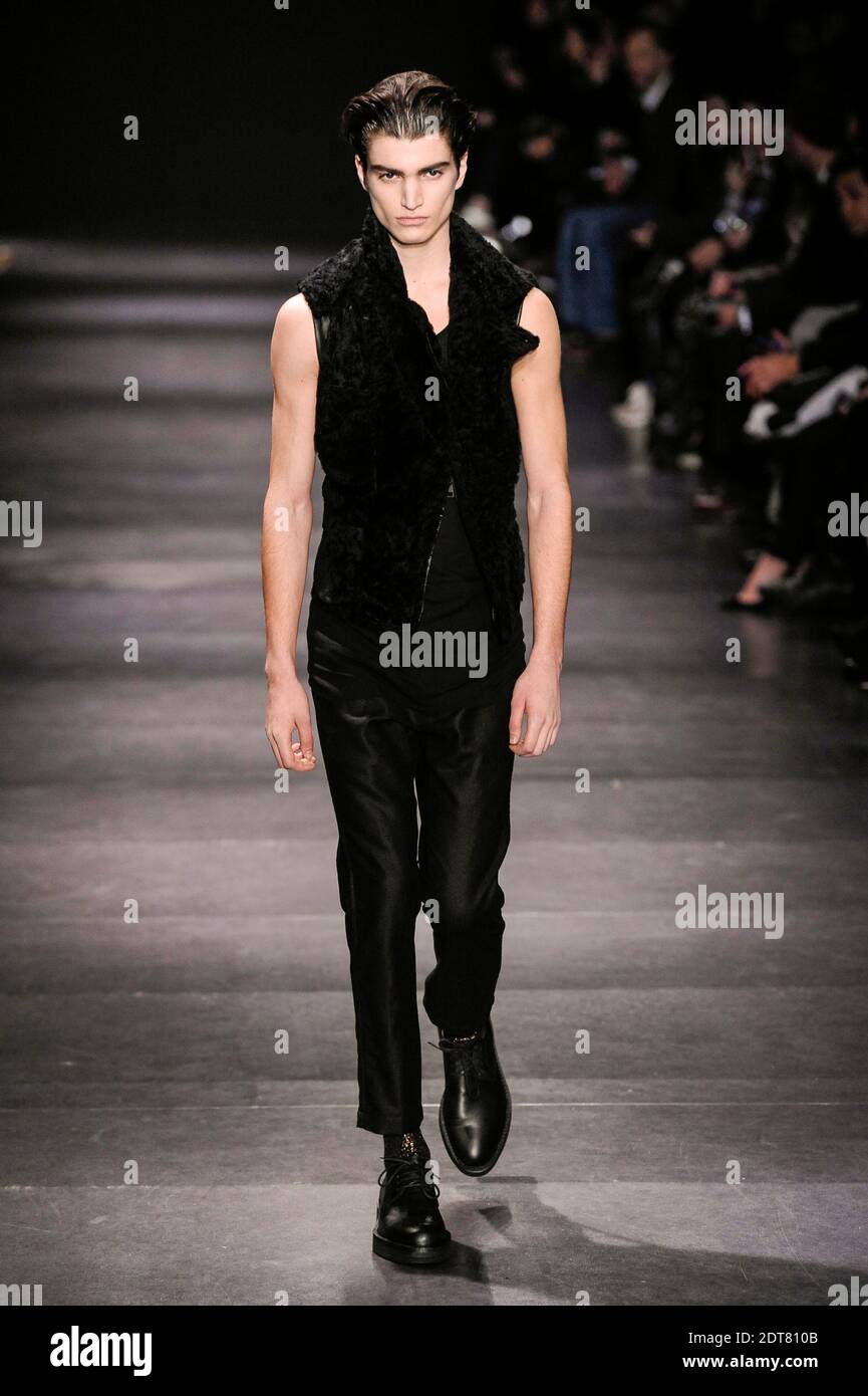A model displays a creation for Ann Demeulemeester Fall-Winter 2014/2015 Ready-To-Wear ...