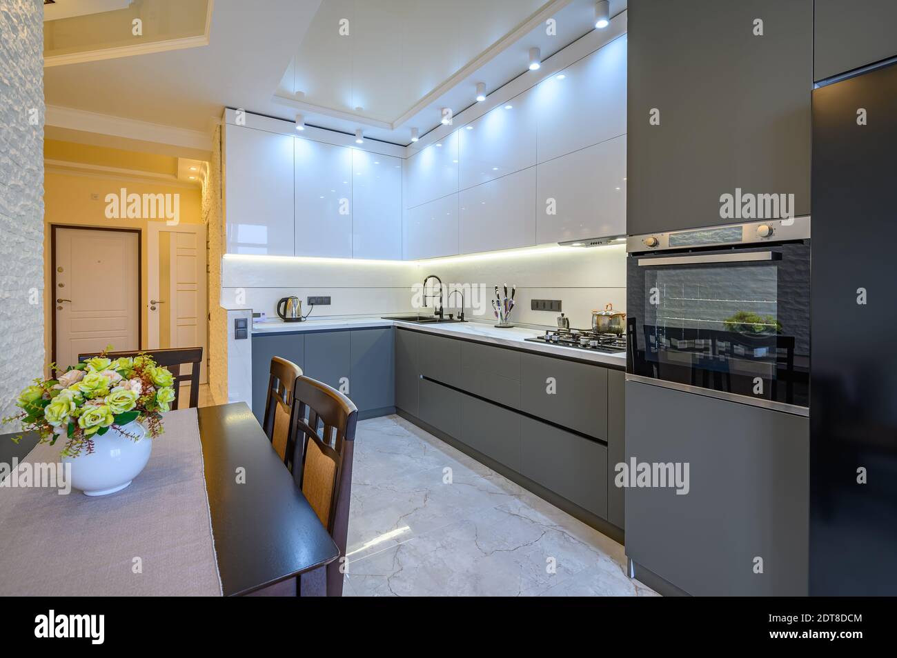 Luxury white and dark grey modern kitchen interior Stock Photo - Alamy