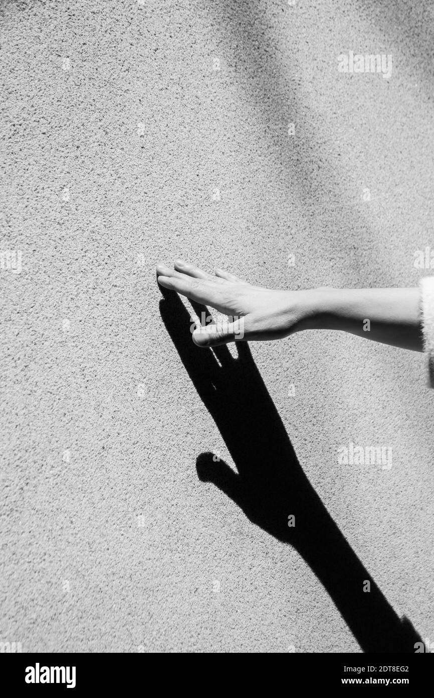 Close-up Of Hand Touching Wall Stock Photo - Alamy