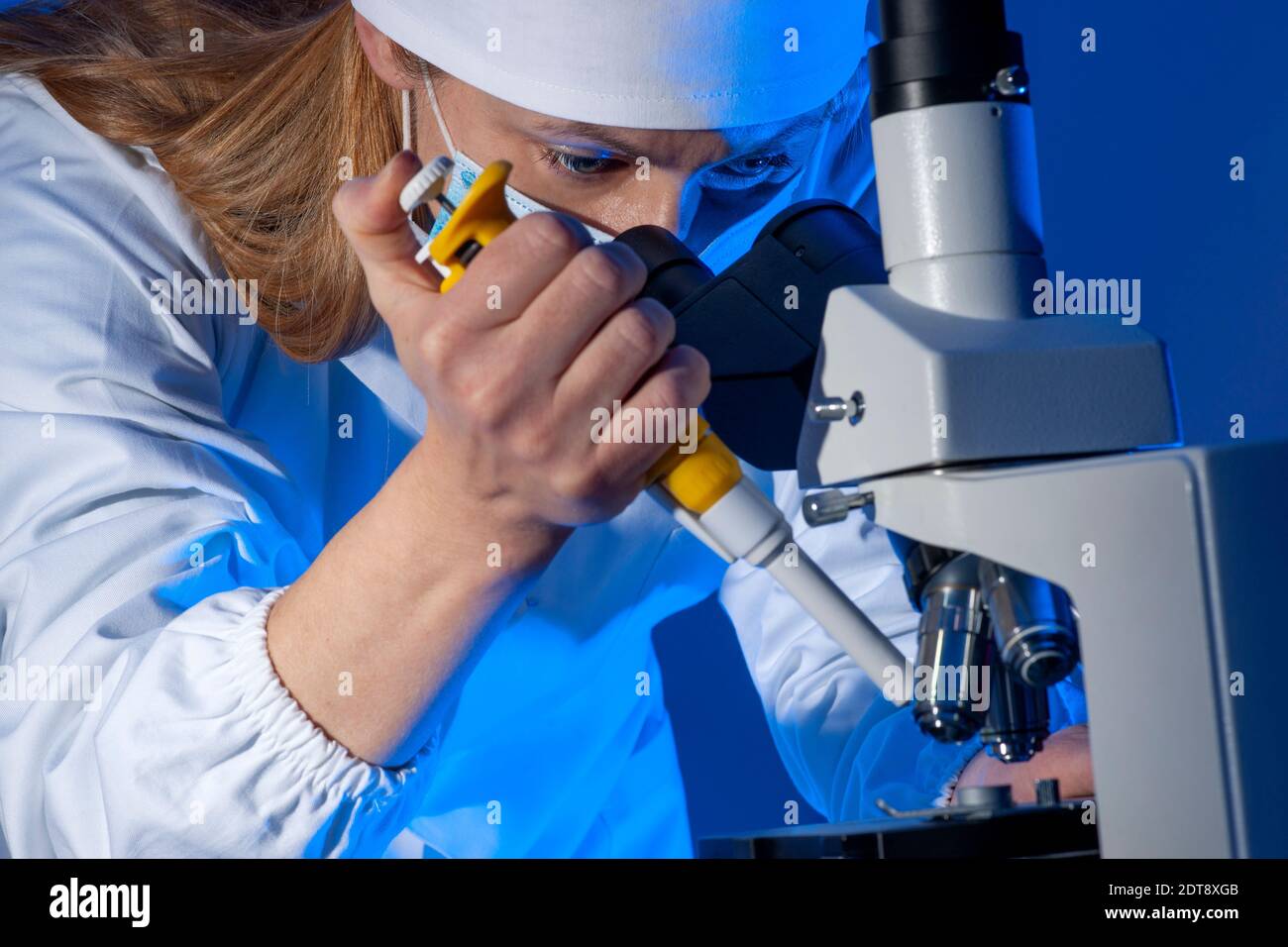 Scientist Performing Experiment In Darkroom Stock Photo - Alamy