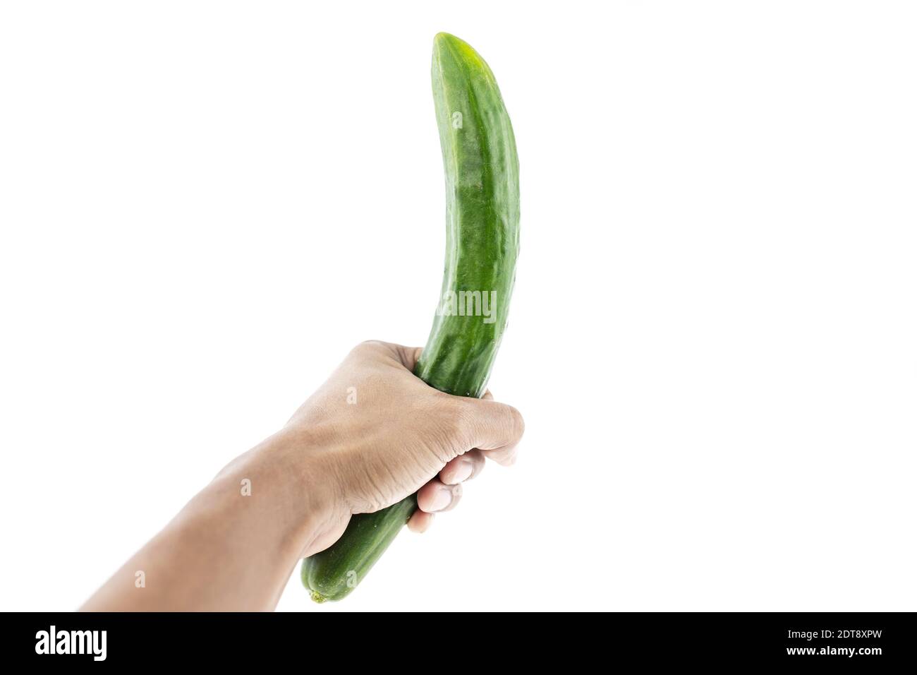 Hand holding cucumber Cut Out Stock Images & Pictures - Alamy