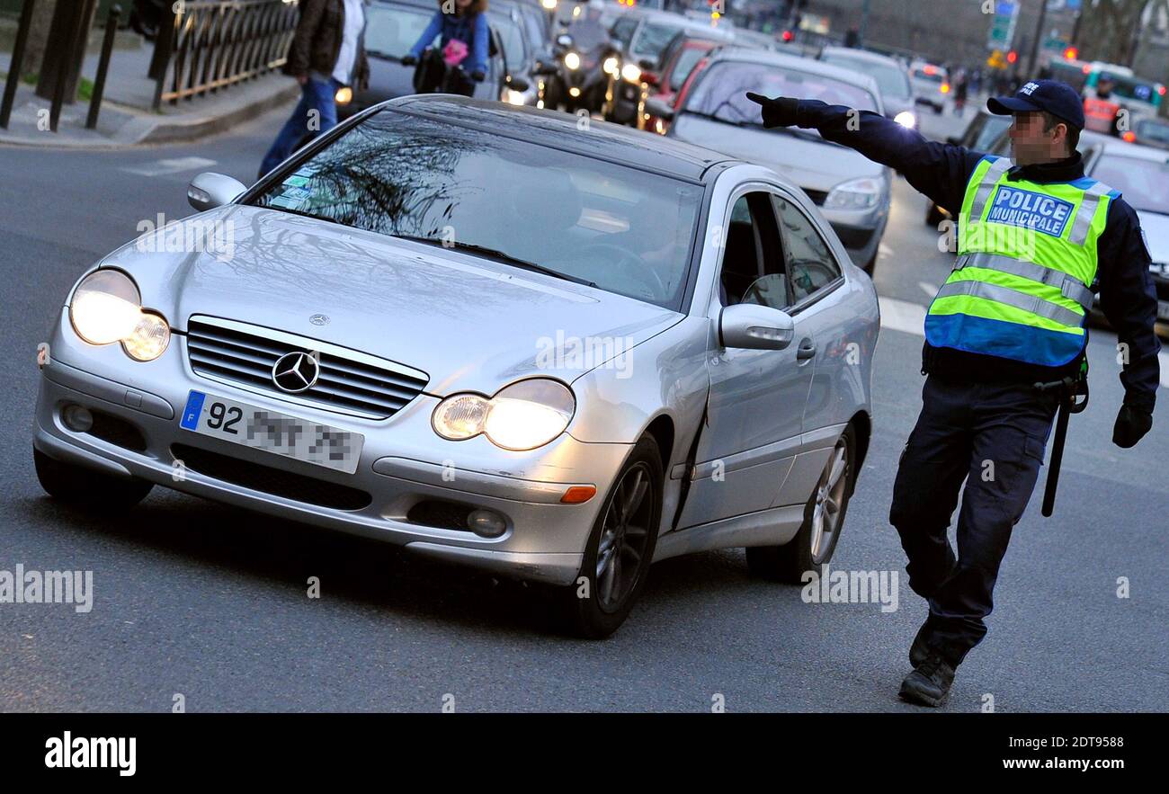 Police officers control cars with number plates ending in even numbers ...