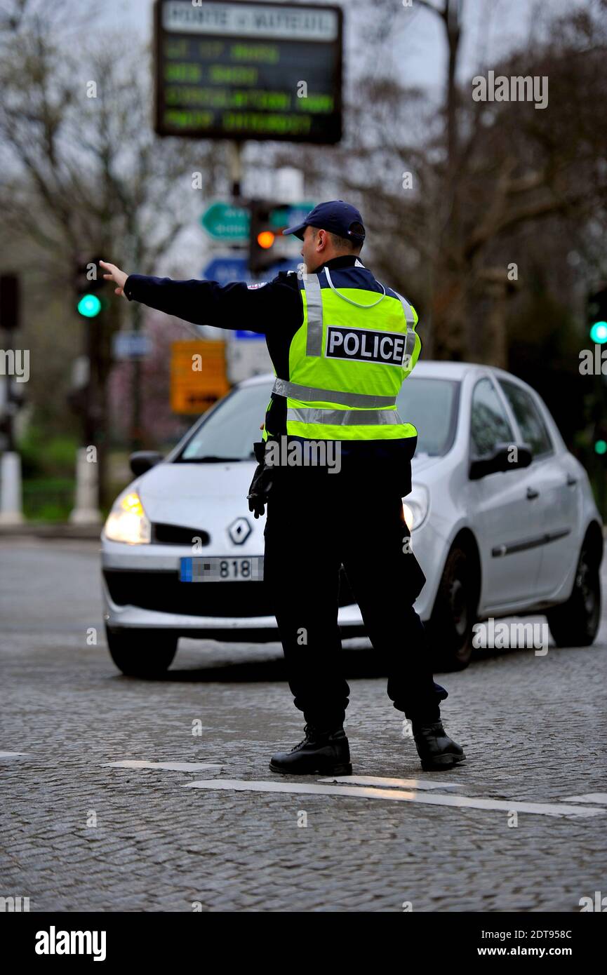 Police officers control cars with number plates ending in even numbers ...