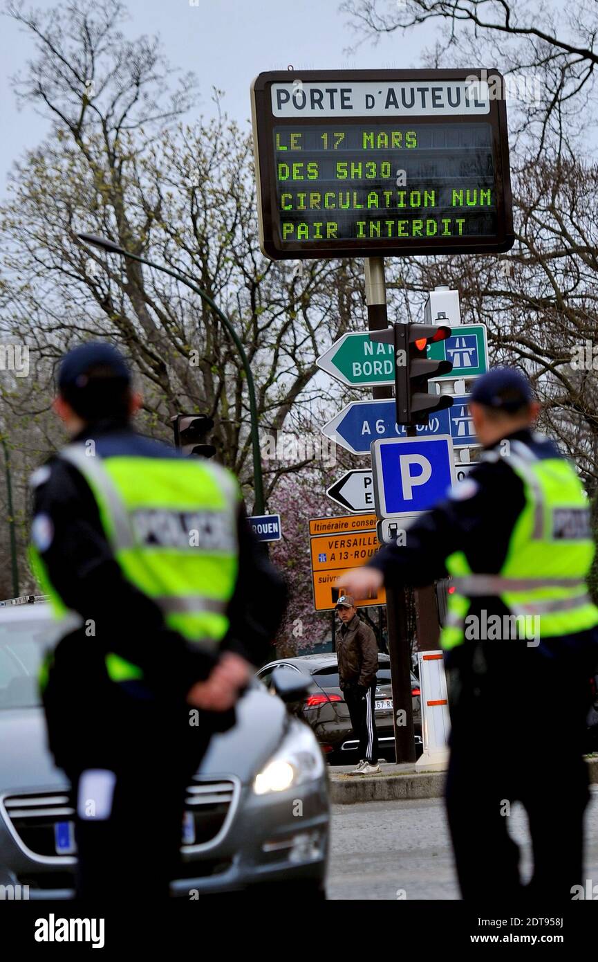 Police officers control cars with number plates ending in even numbers ...