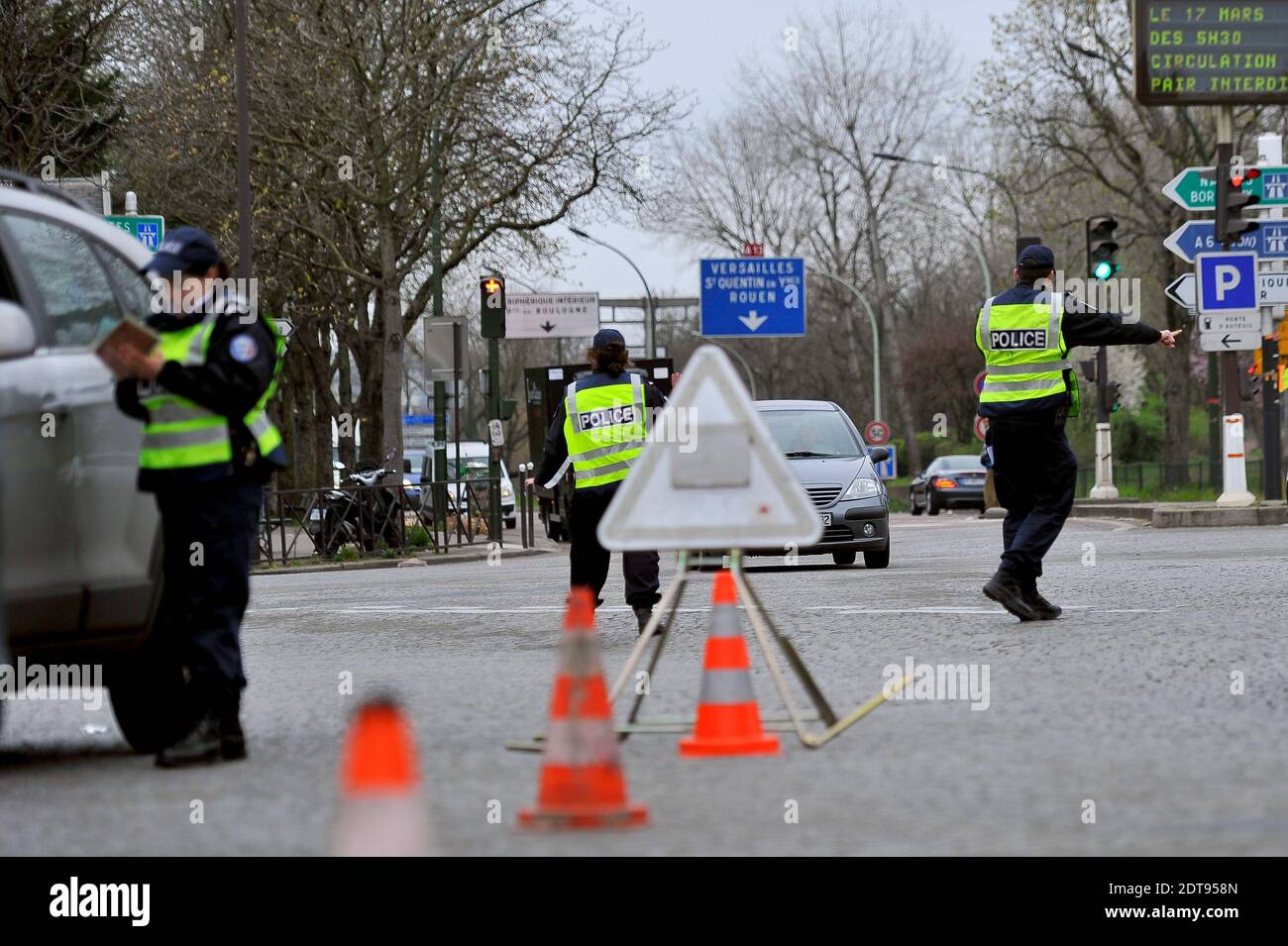Police officers control cars with number plates ending in even numbers ...