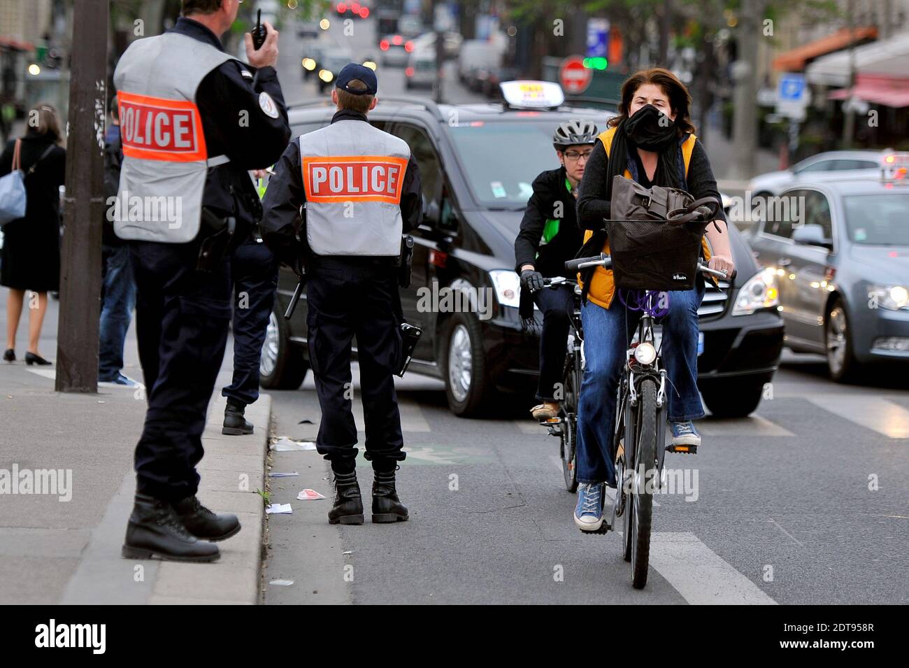 Police officers control cars with number plates ending in even numbers ...