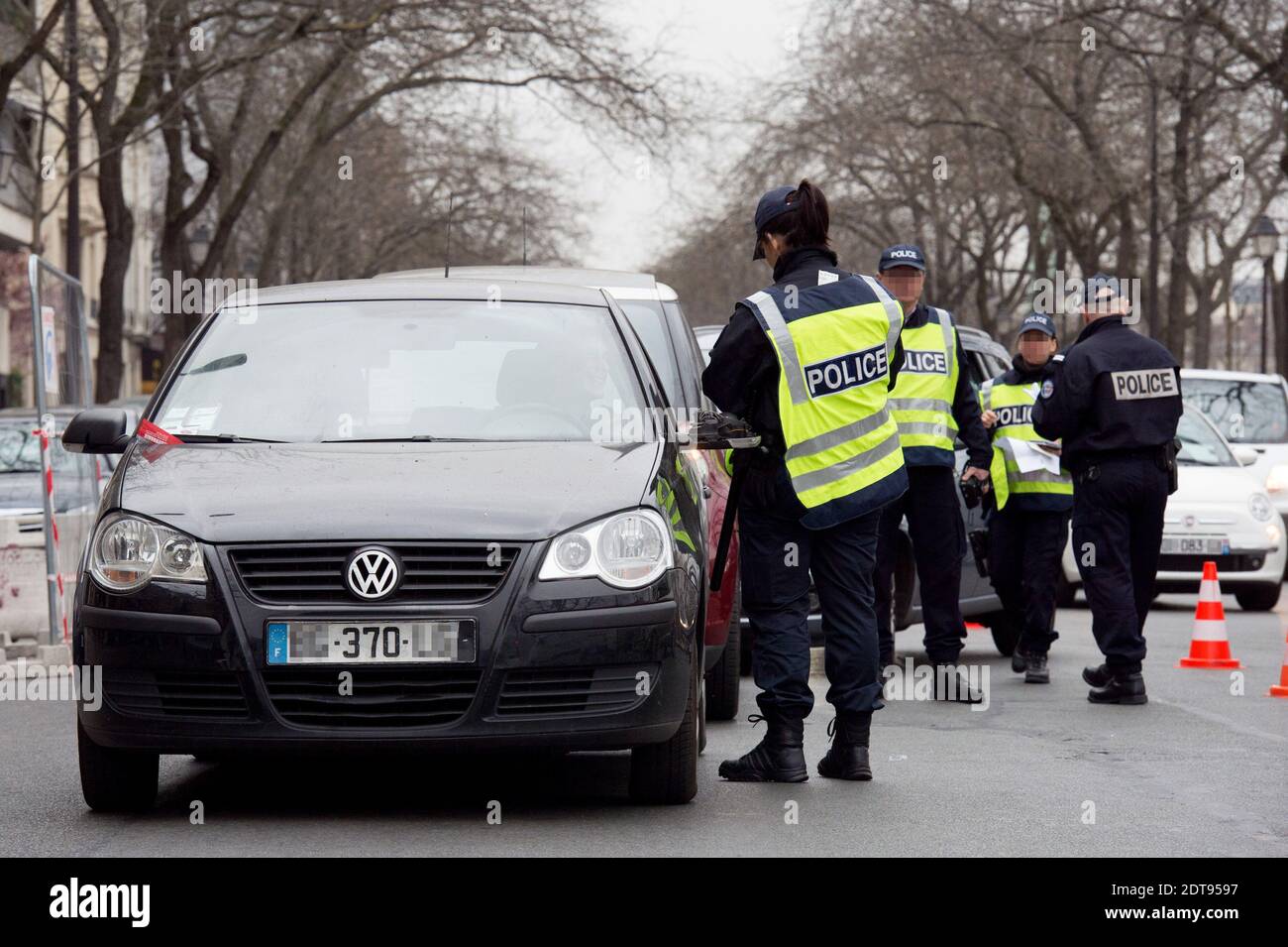 Police officers control cars with number plates ending in even numbers ...